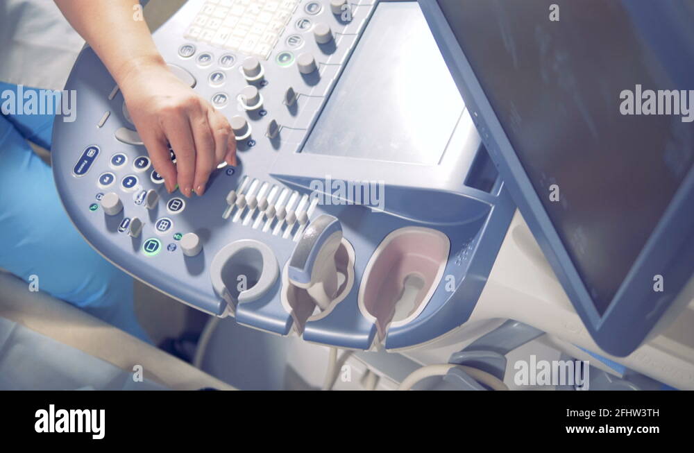Top view of a smiling lady undergoing supersonic procedure. Medical ...