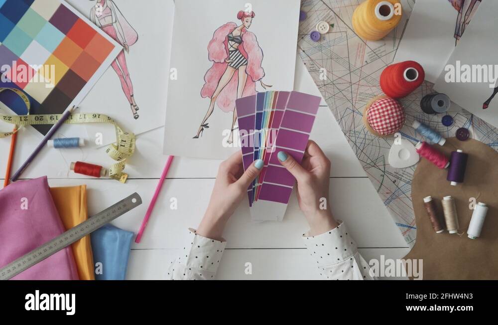 Female fashion designer choosing color palette for her new design Stock ...