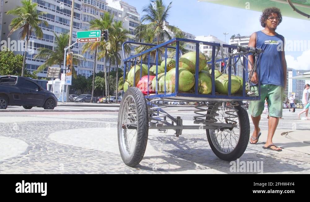 Selling coconuts on a hot Summer day, Copacabana beach in Rio de ...