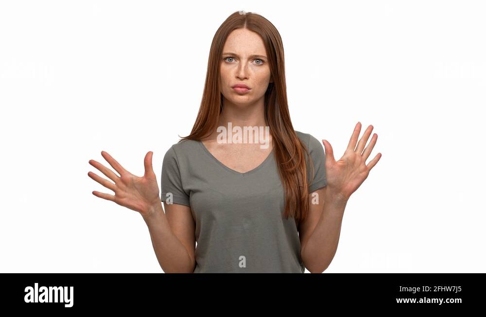 Portrait of disappointed ginger woman 20s expressing perplexity and ...