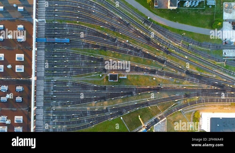 Depot metro, top view of departing passenger subway train from hangar ...