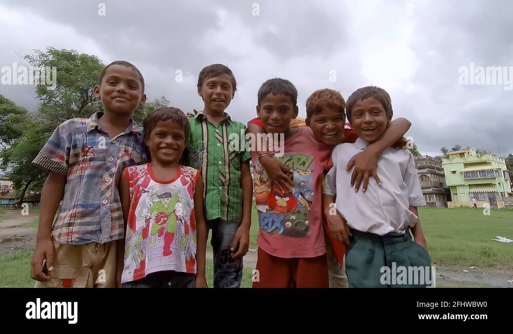 Poor little innocent Indian homeless children playing and laughing with ...