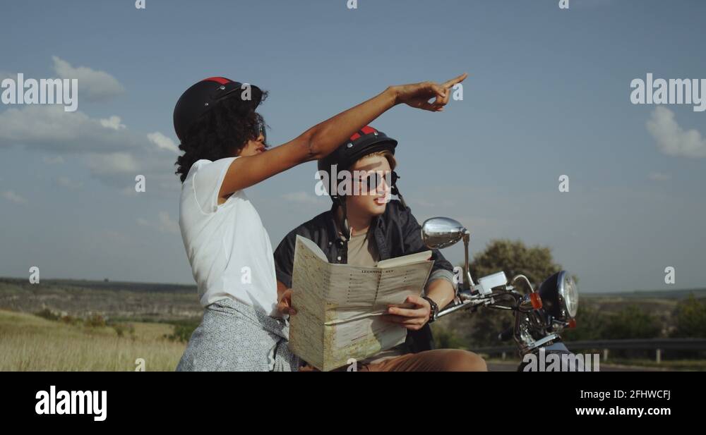 Two friends helping each other find directions on a map. 4k Stock Video ...