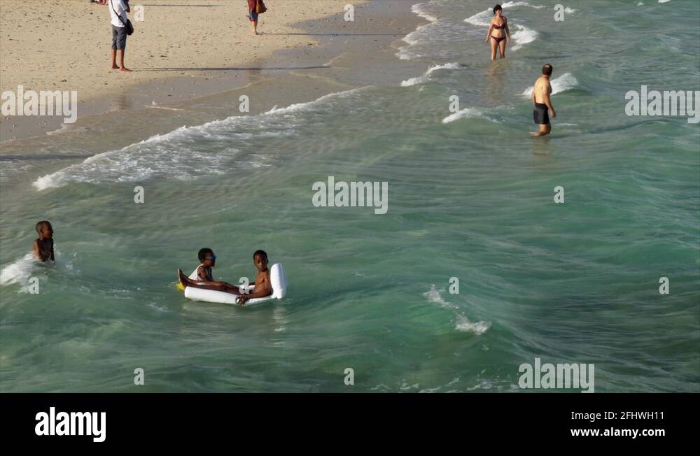 People having a fun day on the beach in Prison Island Zanzibar Tanzania ...