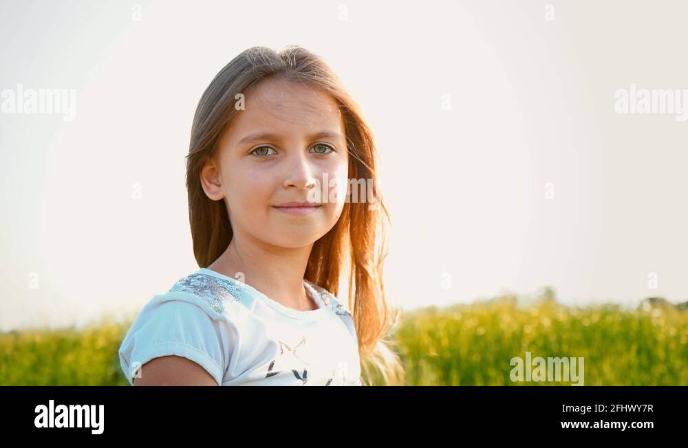Portrait of attractive little girl with a big green eyes on nature background Stock Video ...