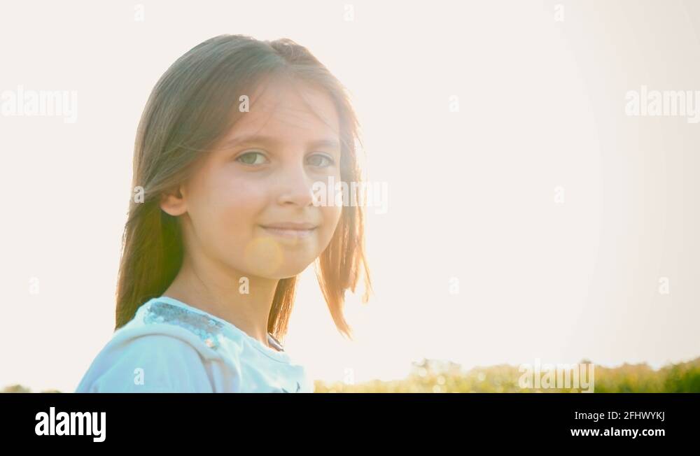 Portrait of attractive little girl with a big green eyes on nature background Stock Video ...