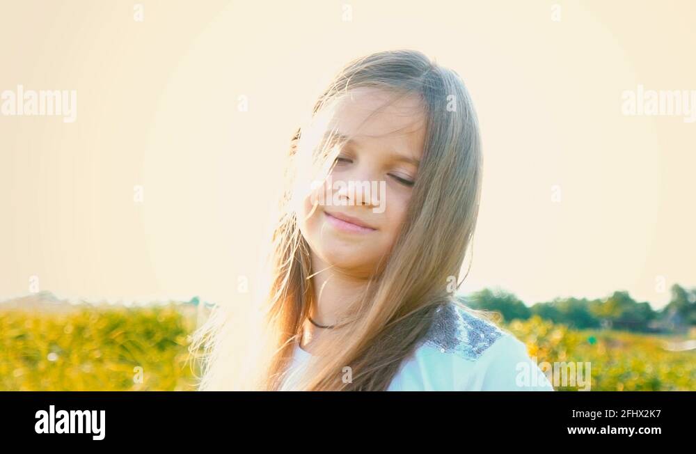 Portrait of attractive little girl with a big eyes on nature background with Stock Video Footage ...