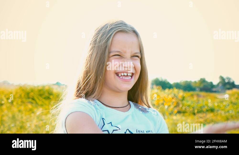 Portrait of attractive little girl with a big eyes on nature background with Stock Video Footage ...