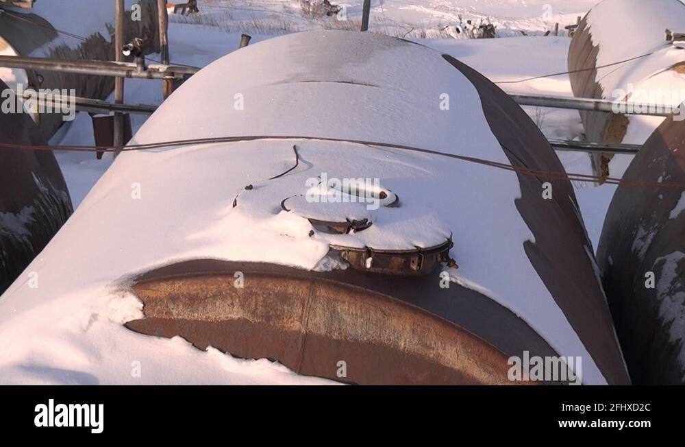 Old abandoned cisterns of tank farm Anadyr city on far north of Russia ...