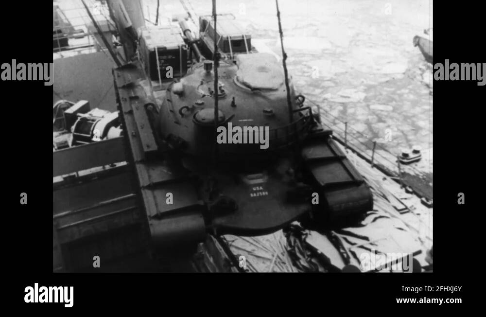 Crane vessel moves a military tank to a tank carrier - 1955 Stock Video ...