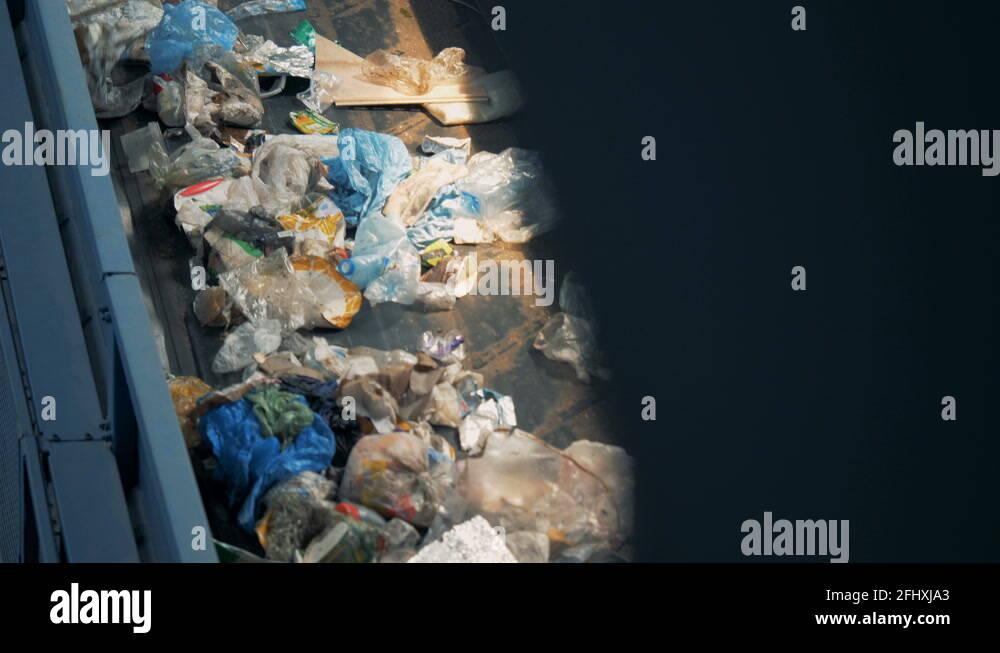 Recycling factory with conveyors. Sorting garbage equipment working at ...