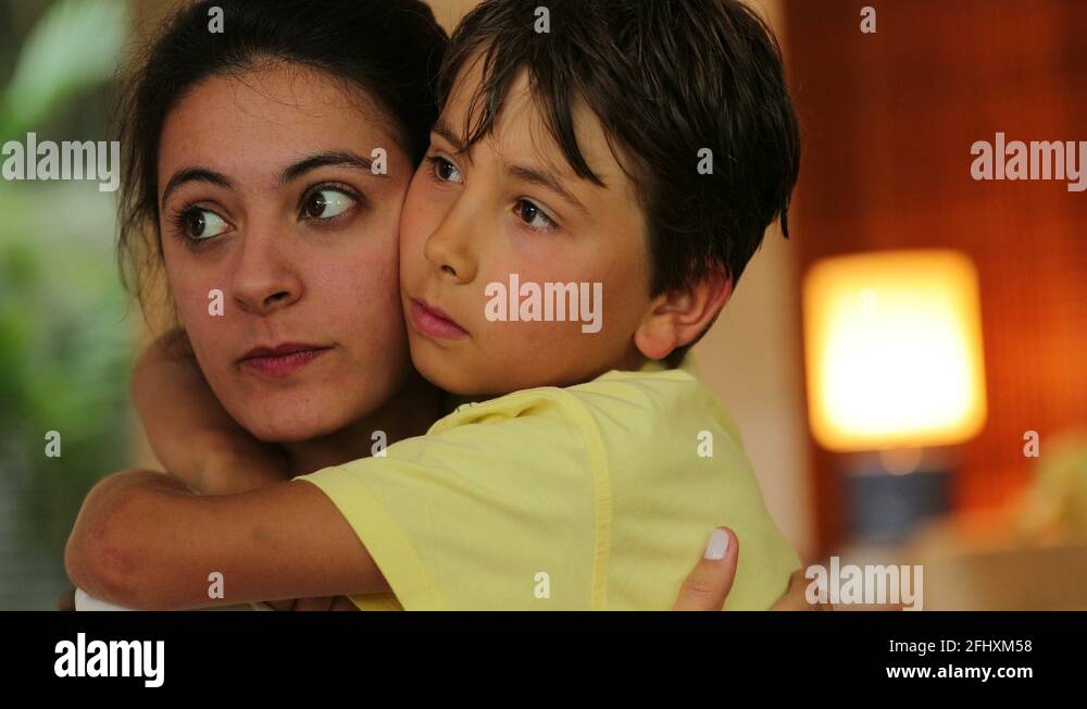 Child hugging young 30 year old woman. Young boy hugs older sister ...