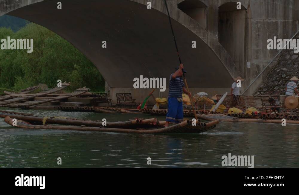 ancient traditional bamboo raft ride at yulong li river with scenic ...