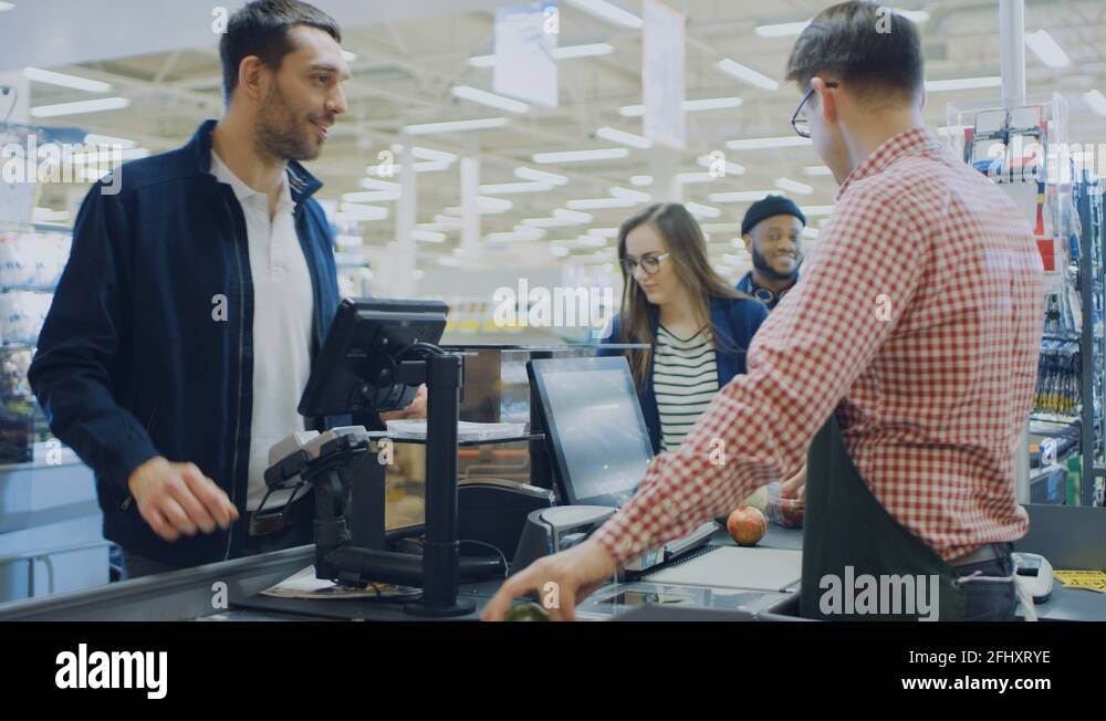 At the Supermarket: Checkout Counter Happy Customer Chats with Friendly ...