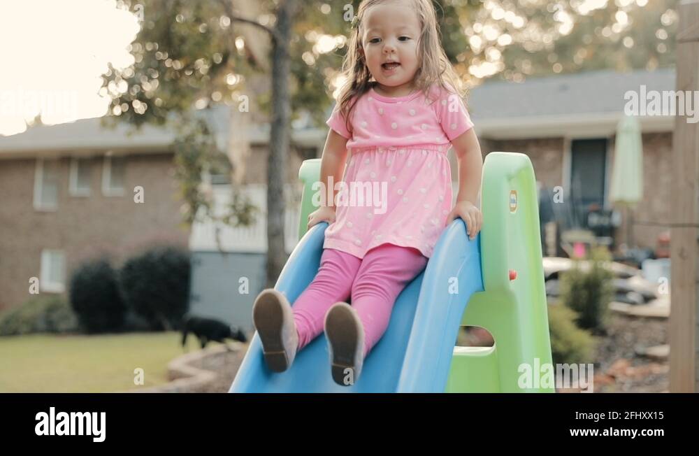 Girl going down slide Stock Videos & Footage - HD and 4K Video Clips ...
