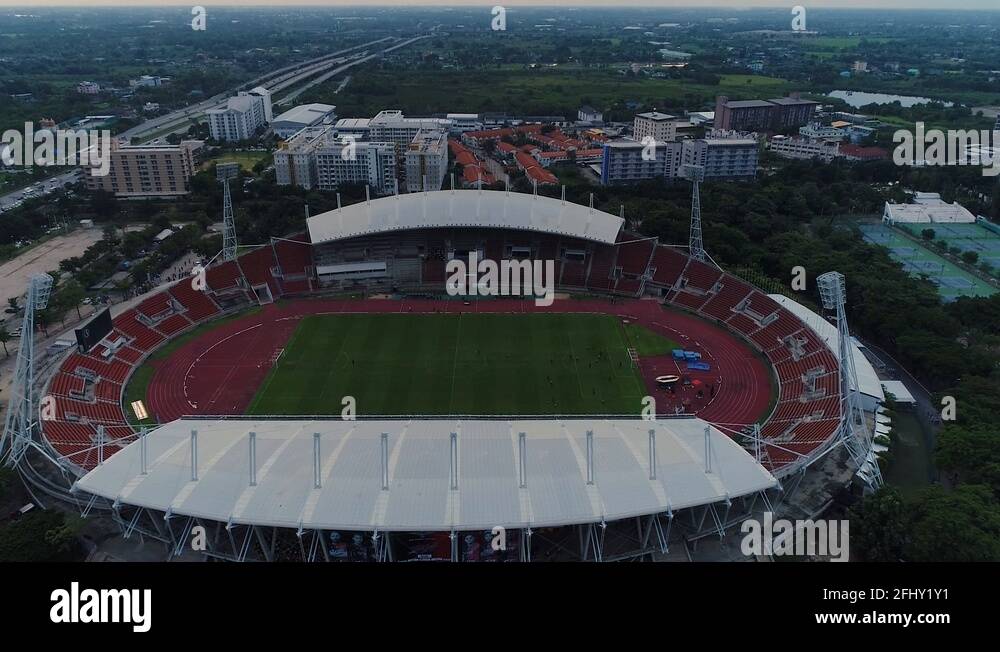 Thammasat University main stadium bird’s-eye view by drone zoom in to ...