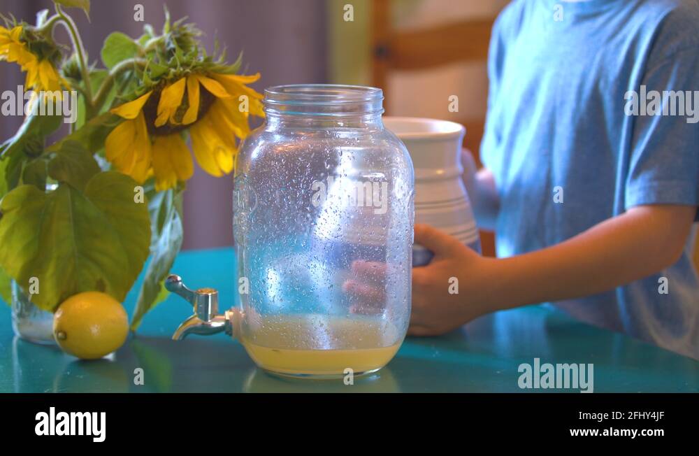 Boy pouring water Stock Videos & Footage - HD and 4K Video Clips - Alamy