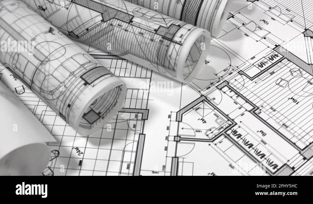 Blueprints - rolls of architectural drawings smoothly rotate on the ...