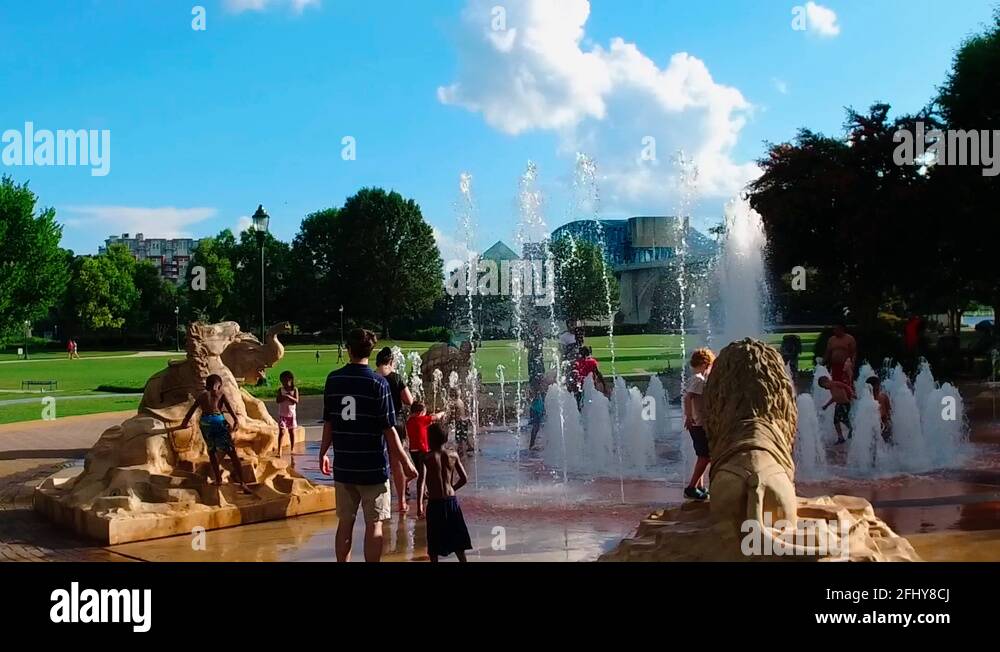 kids playing in Coolidge Park interactive water park fountain. downtown ...