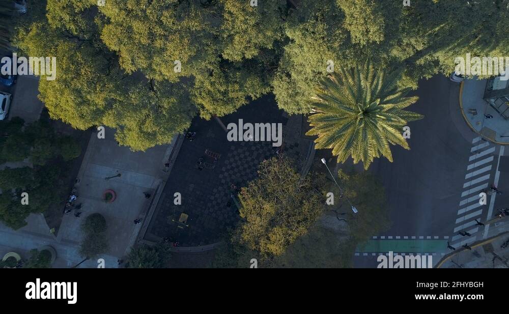 bird's-eye view of children playing in the playground of a park ...