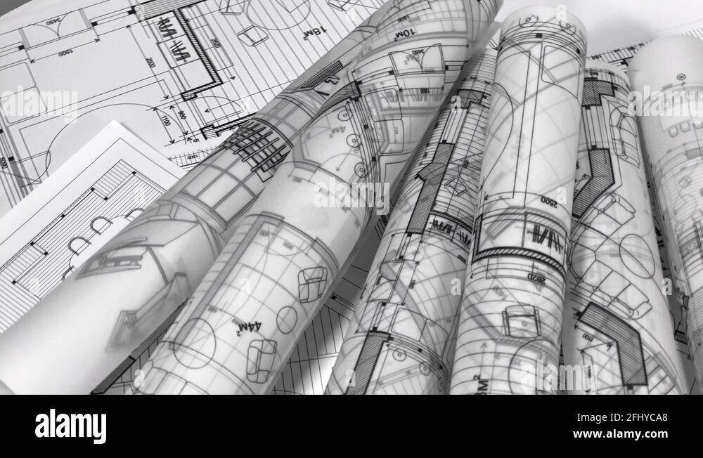 Blueprints - rolls of architectural drawings smoothly rotate on the ...
