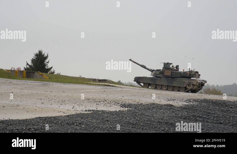 U.S. soldiers fire M1A2 Sepv2 Abrams Main Battle Tanks during Exercise ...
