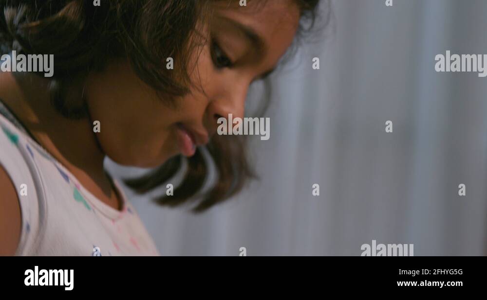 tilt from little girls face to her craft project 4k Stock Video Footage ...