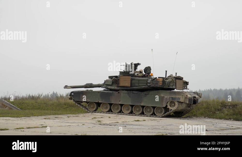 U.S. soldiers fire M1A2 Sepv2 Abrams Main Battle Tanks during Exercise ...