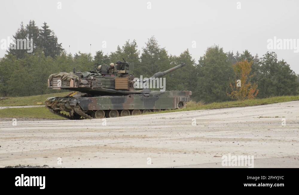 U.S. soldiers fire M1A2 Sepv2 Abrams Main Battle Tanks during Exercise ...
