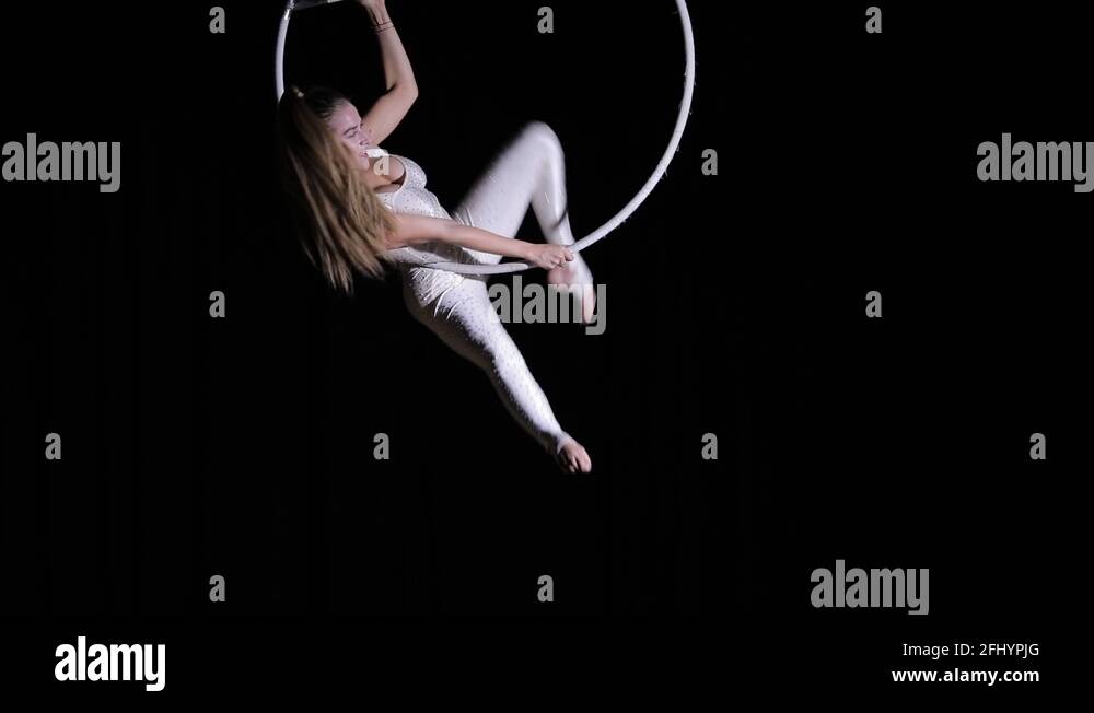 Circus artist make acrobatic trick hanging in ring Stock Video Footage ...