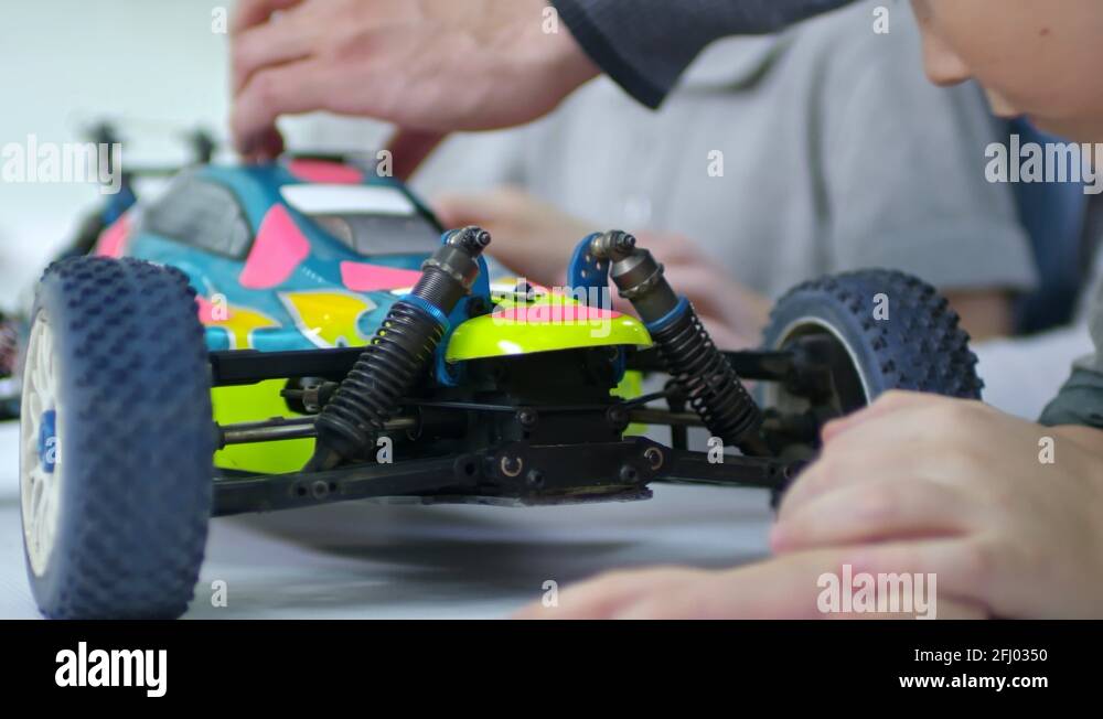 Boy Studying Mechanisms of Toy Car Stock Video Footage - Alamy