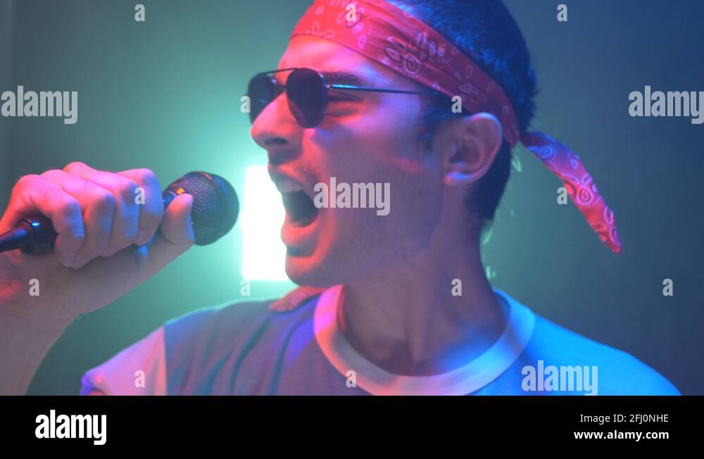 80s Singer Performing Live on Stage With a Mic Stock Video Footage - Alamy