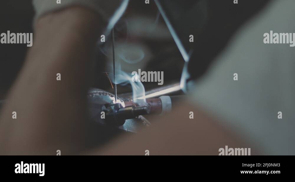 Automaster weld the frame of custom motorcycle Stock Video Footage - Alamy