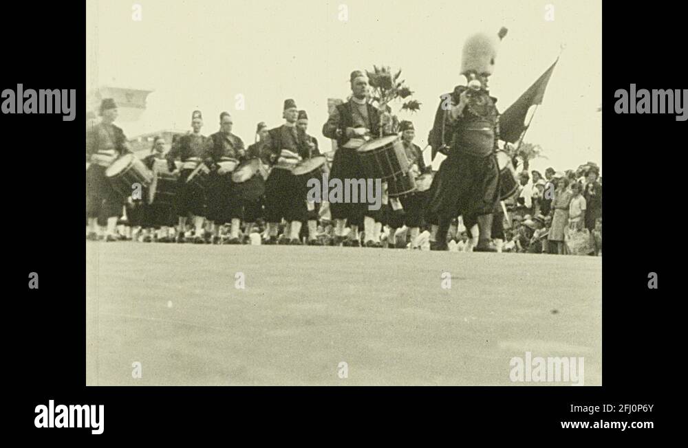 1920s: Marching snare drum players play. Marching band brass march and ...