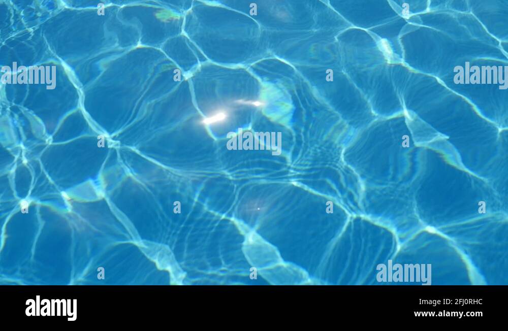 Calming swimming pool backdrop shining with diamond waters in slo-mo ...