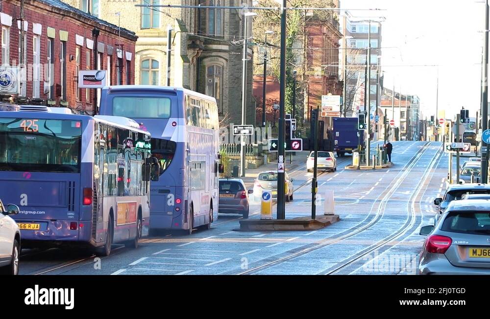 Buses and cars driving by in the distance Stock Video Footage - Alamy