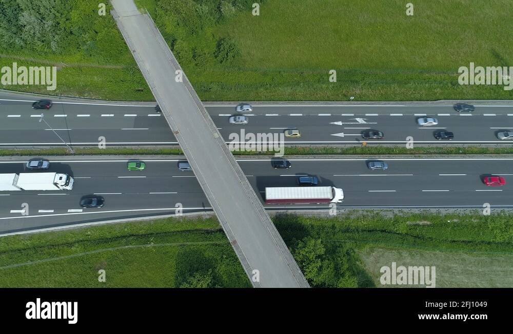 TOP DOWN: Cars and trucks drive through a congestion forming under the ...