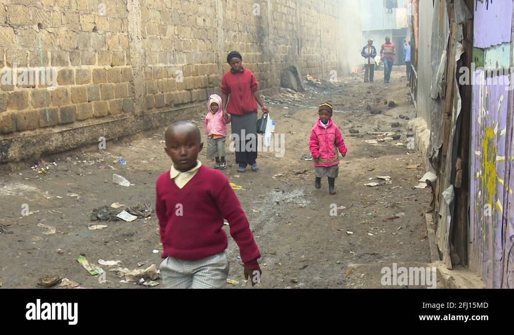 Mother and daughters in a street of Kibera, the largest slum on the ...