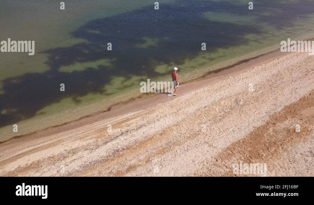 One man walking on beach Stock Videos & Footage - HD and 4K Video Clips ...