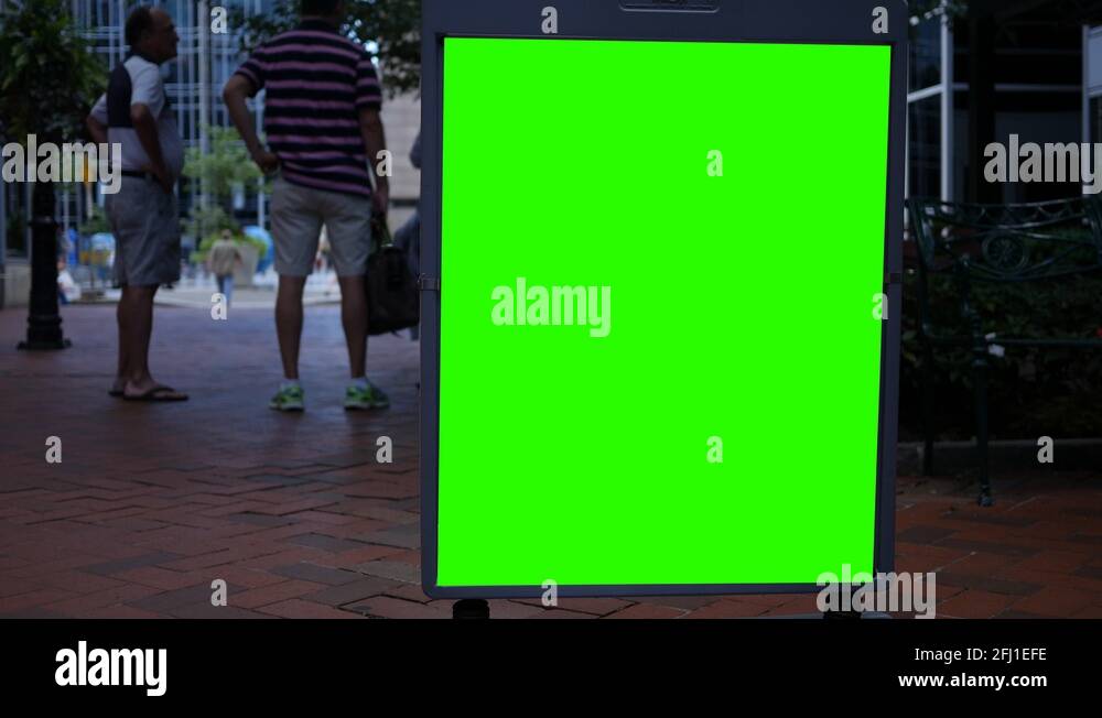 Green screen advertisement in a steel frame in downtown area Stock ...