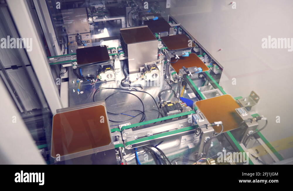 Working conveyor with solar module plates. Renewable energy concept ...