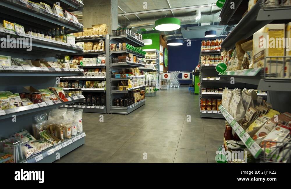 Grocery store interiors, with decked up shelves brightly lit in Warsaw ...