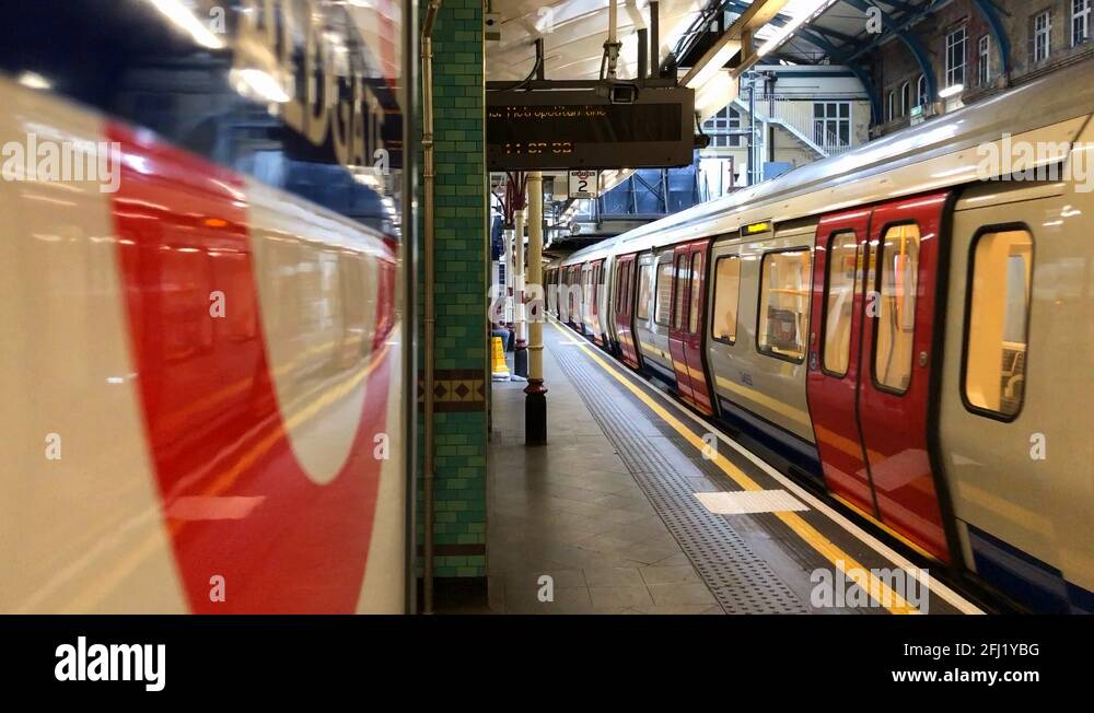 Metropolitan Line Train departing Aldgate Underground Station in London ...