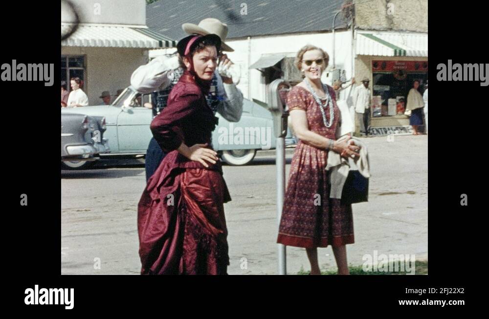 1950s: Three women in old-fashioned costumes pose for the camera Stock ...