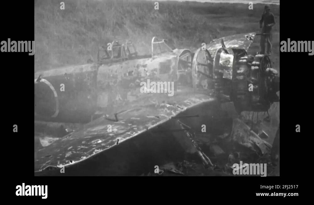 WW2 1945 - Destroyed fighter burning on Tokuno airfield Stock Video ...