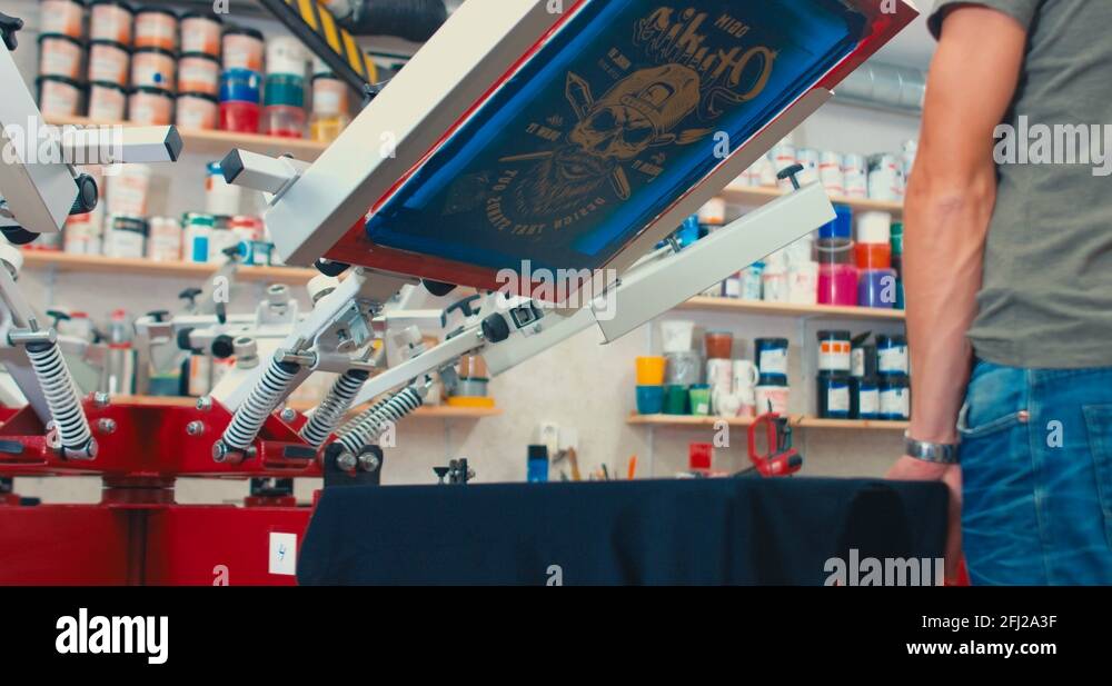 Silk screen printing process - making a print on a t-shirt. 4K UHD ...