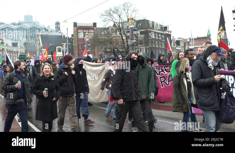 Members of the antifa,the anti fascists, marching in their black ...
