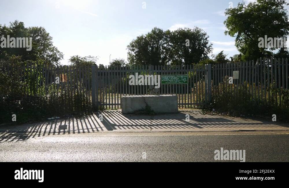 I don't know why, but a concrete slab in front of a gate system I Stock ...
