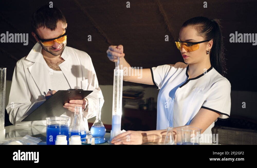 Two scientists work in the laboratory. Testing of chemicals. Scientific ...