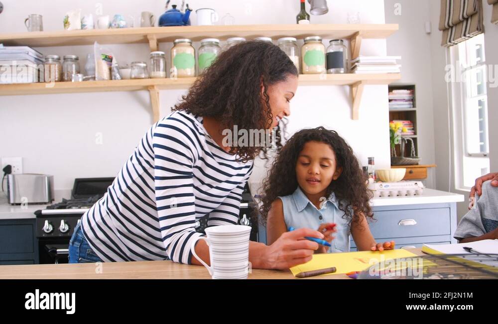 Young black family talking at their kitchen island, close up Stock ...